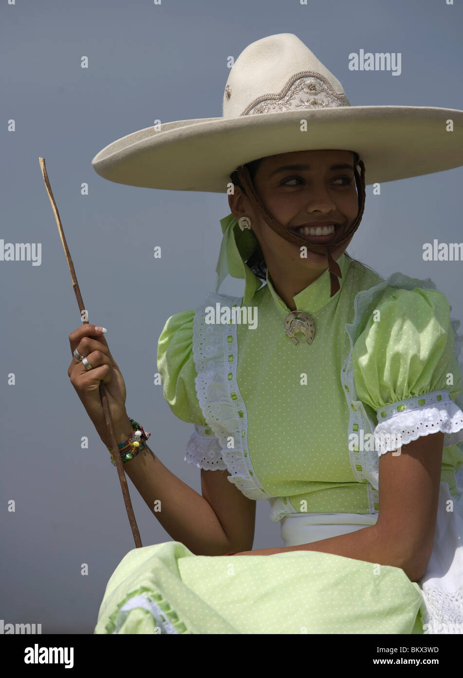 An Amazona rider ride her horse as she competes in an Escaramuza women ...