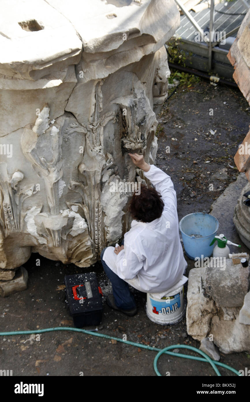 archaeologist cleaning ancient roman relics in trajan's forum area in ...