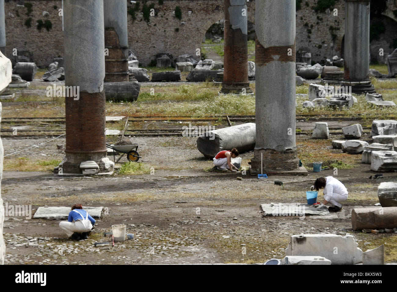 archaeologist cleaning ancient roman relics in trajan's forum area in ...
