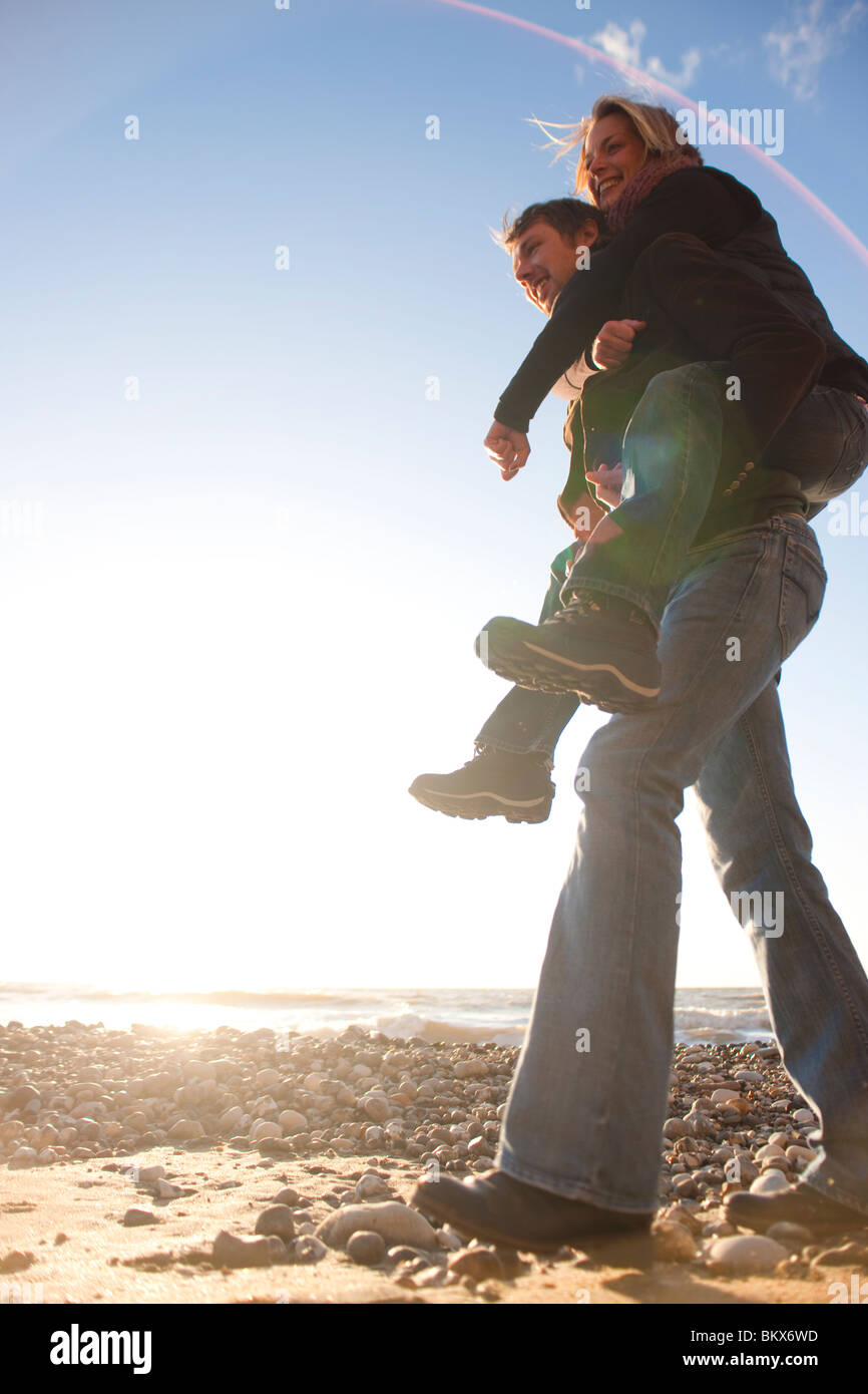 Woman Riding Piggyback On Man High Resolution Stock Photography and ...