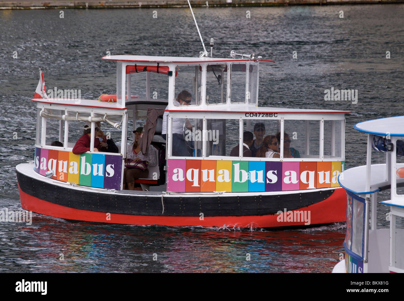 Colourful Granville Island 'tub' mini-ferry traveling between Downtown ...