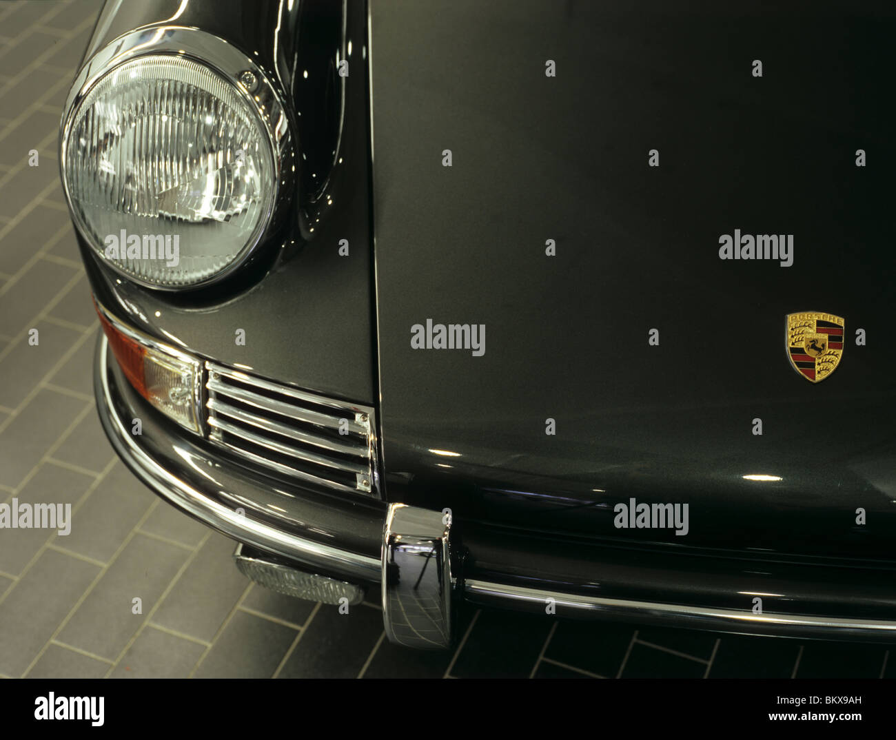 Front right view of a sixties Porsche 911 with the logo of the company ...