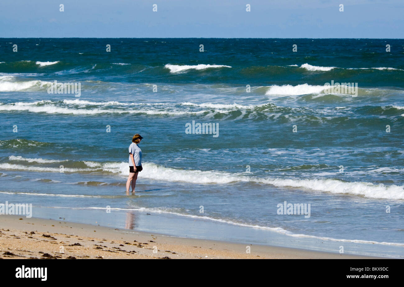 Woman in the waves of the Atlantic Ocean in North Carolina Stock Photo ...