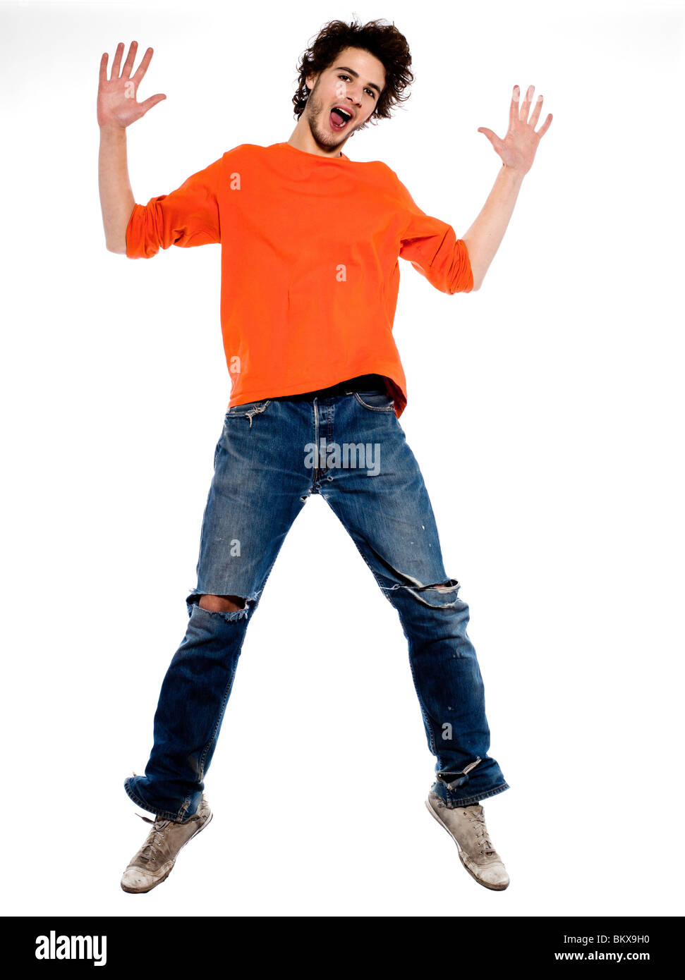 one expressive caucasian young man screaming happy joy full length in ...