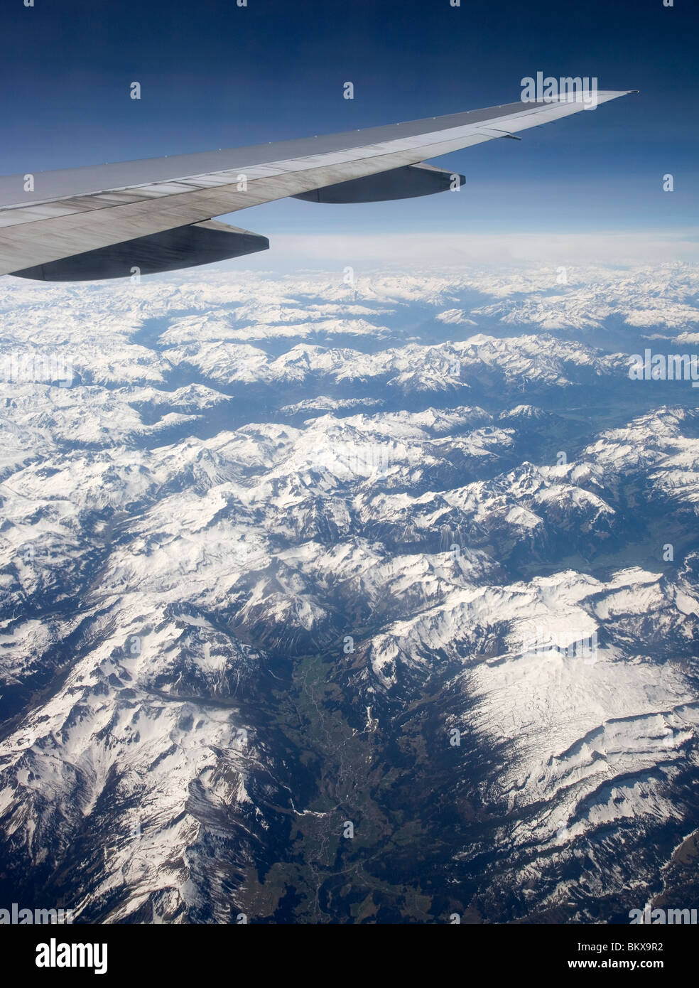 Airplane wing over the Alps Stock Photo - Alamy
