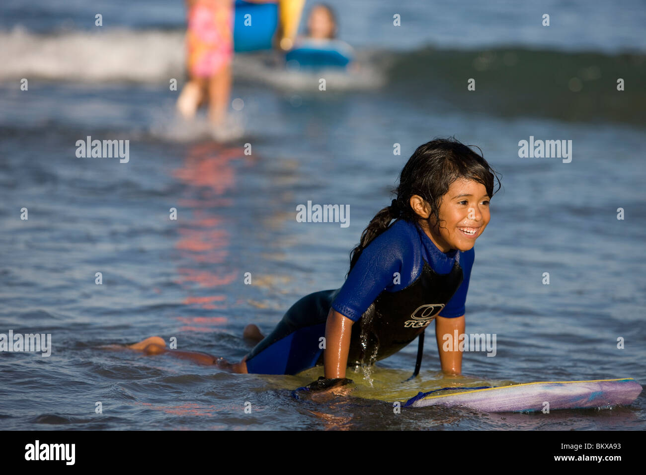 A young girl boogie boarding at Hampton Beach in Hampton Beach, New ...