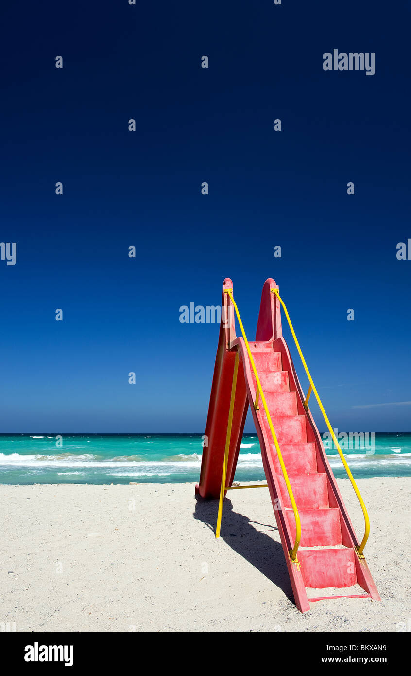 Playground slide on the beach in Oman Stock Photo - Alamy