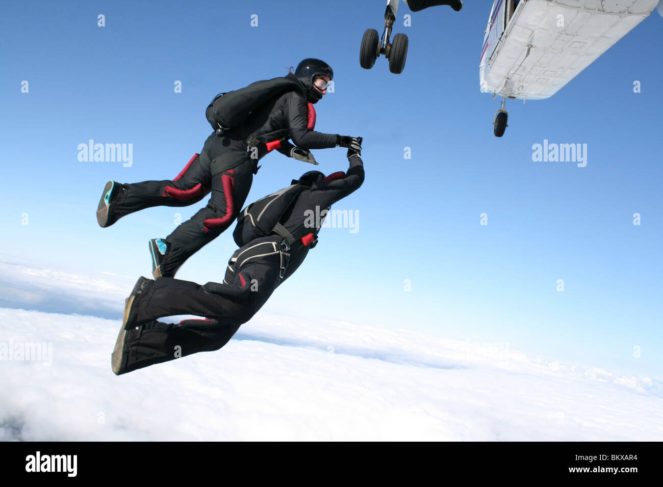 Two skydivers jump from a plane Stock Photo - Alamy