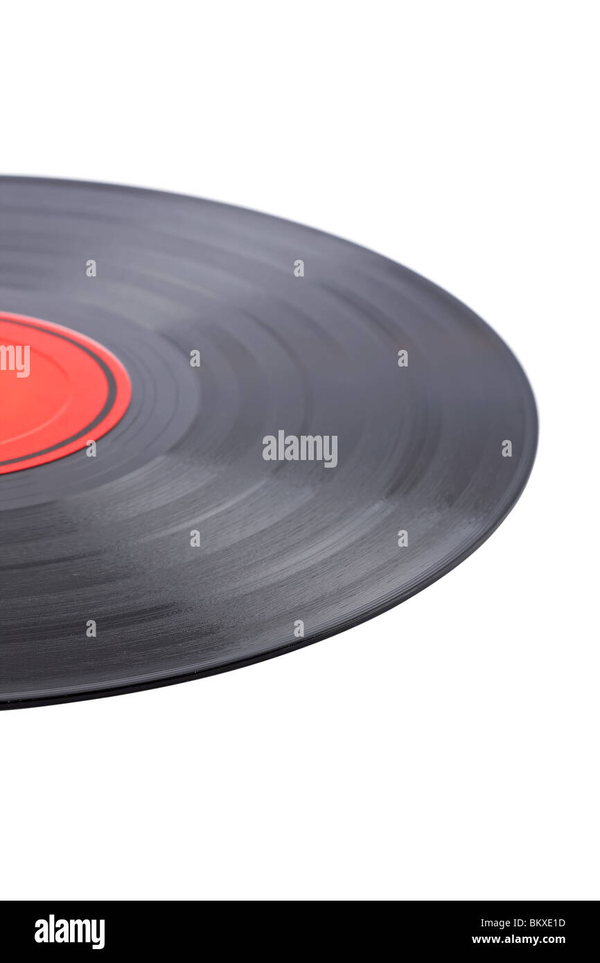 Dusty vinyl record with red label isolated on white background. Focus ...