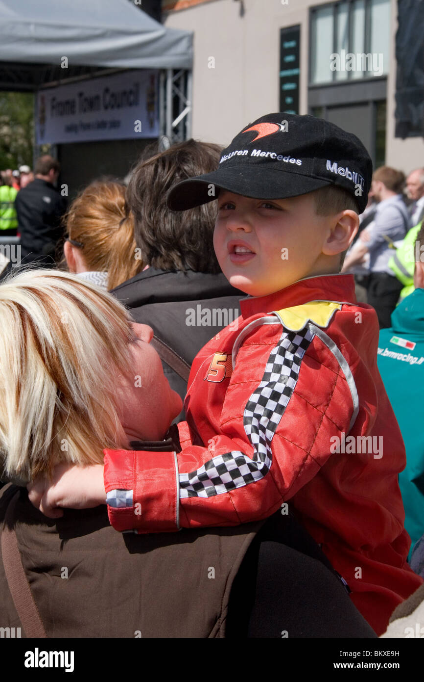 A young boy in racing gear at the return of world racing champion ...
