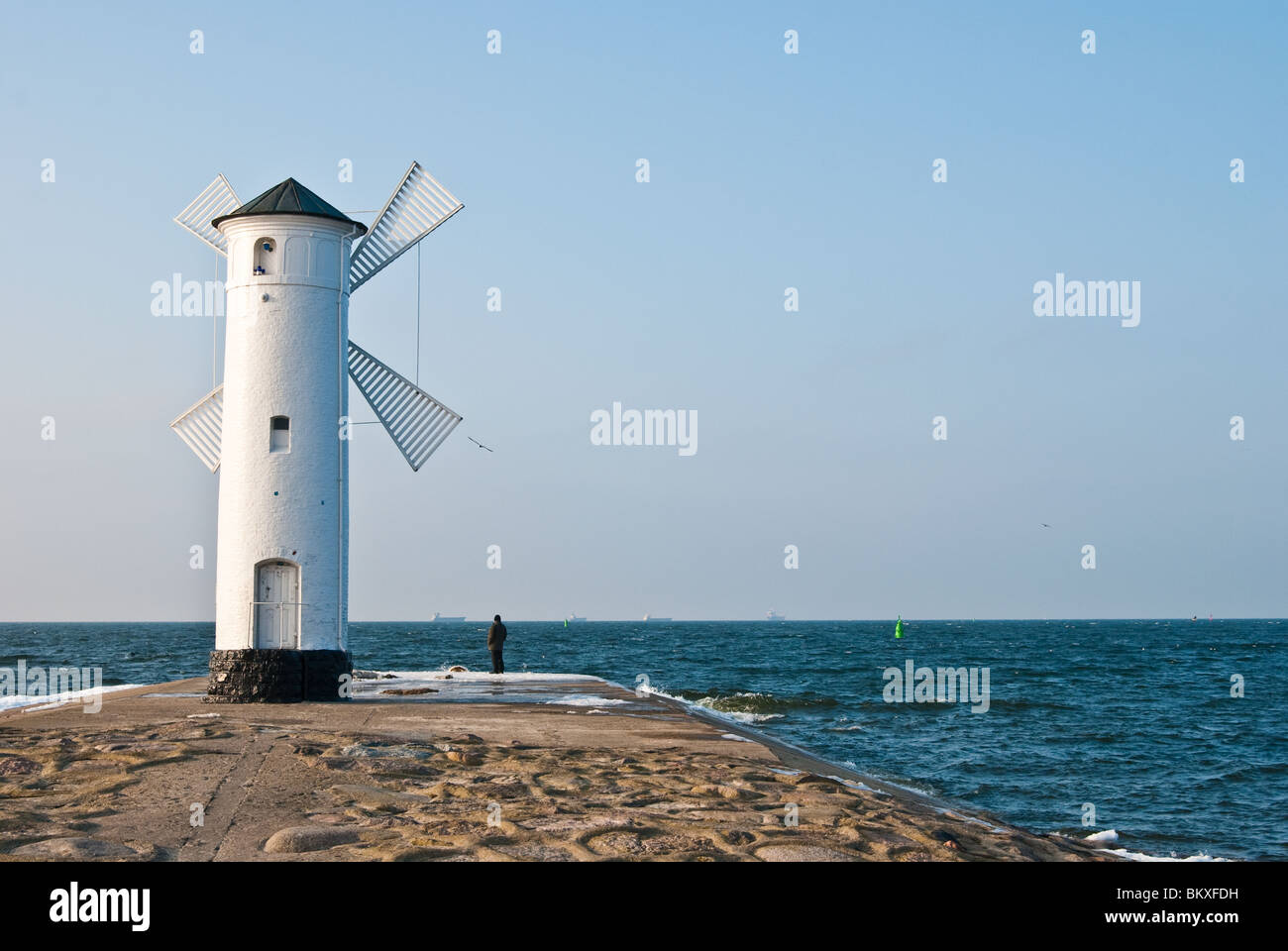 windmill on the seashore Stock Photo - Alamy