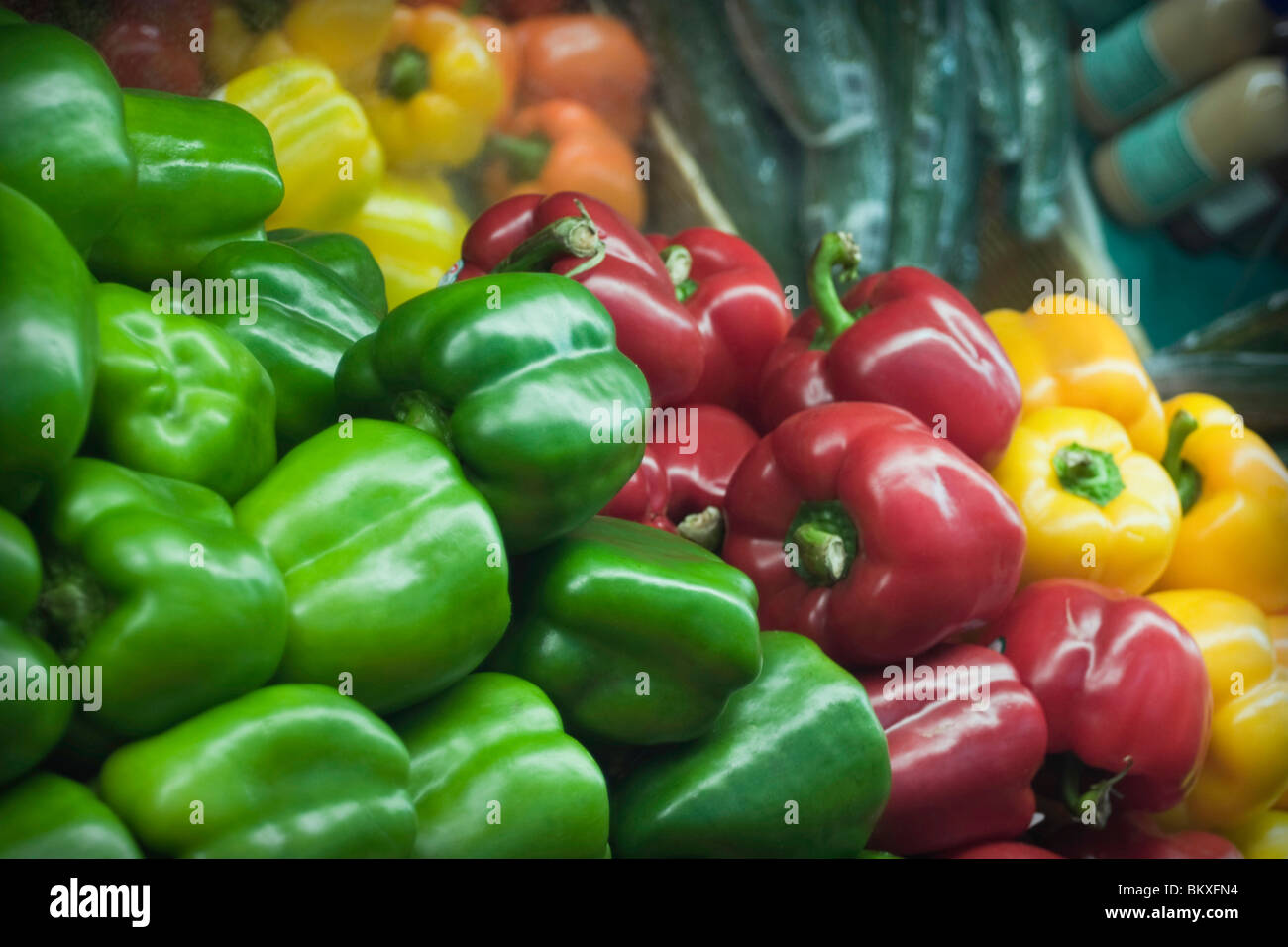 Red, yellow and green bell peppers display market Stock Photo - Alamy