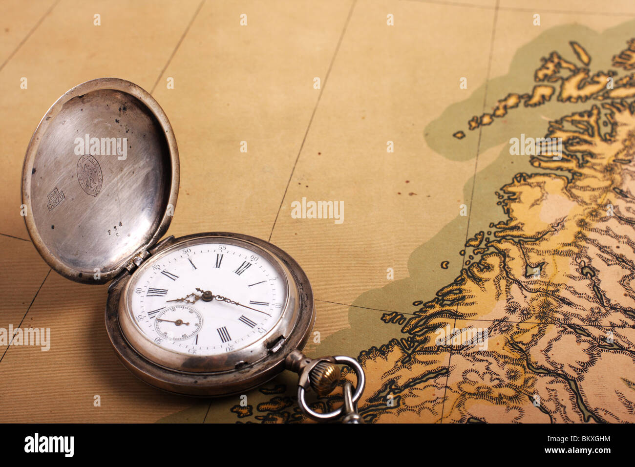 Old silver pocket watch on ancient map Stock Photo - Alamy