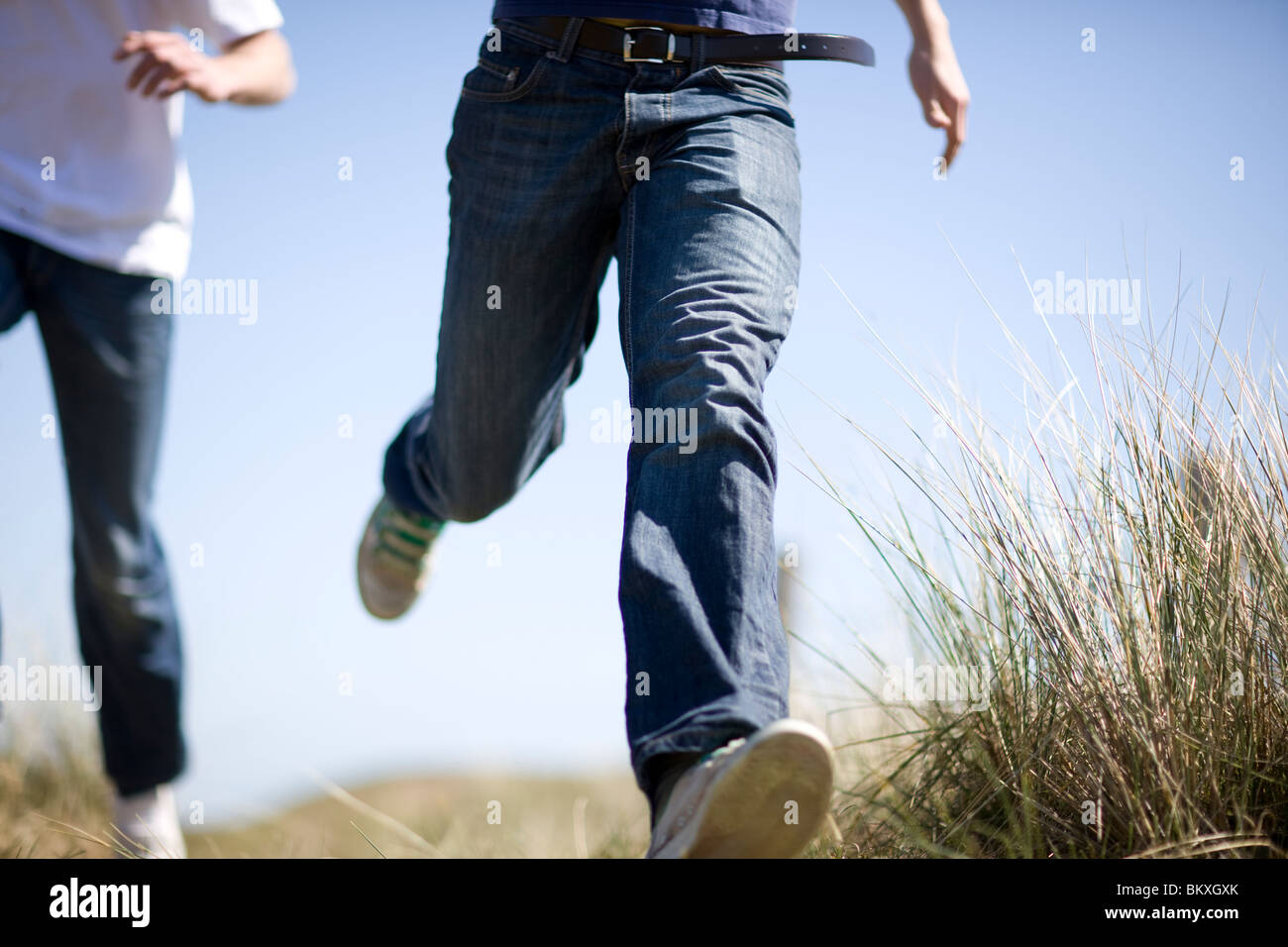 Men running - headless Stock Photo - Alamy