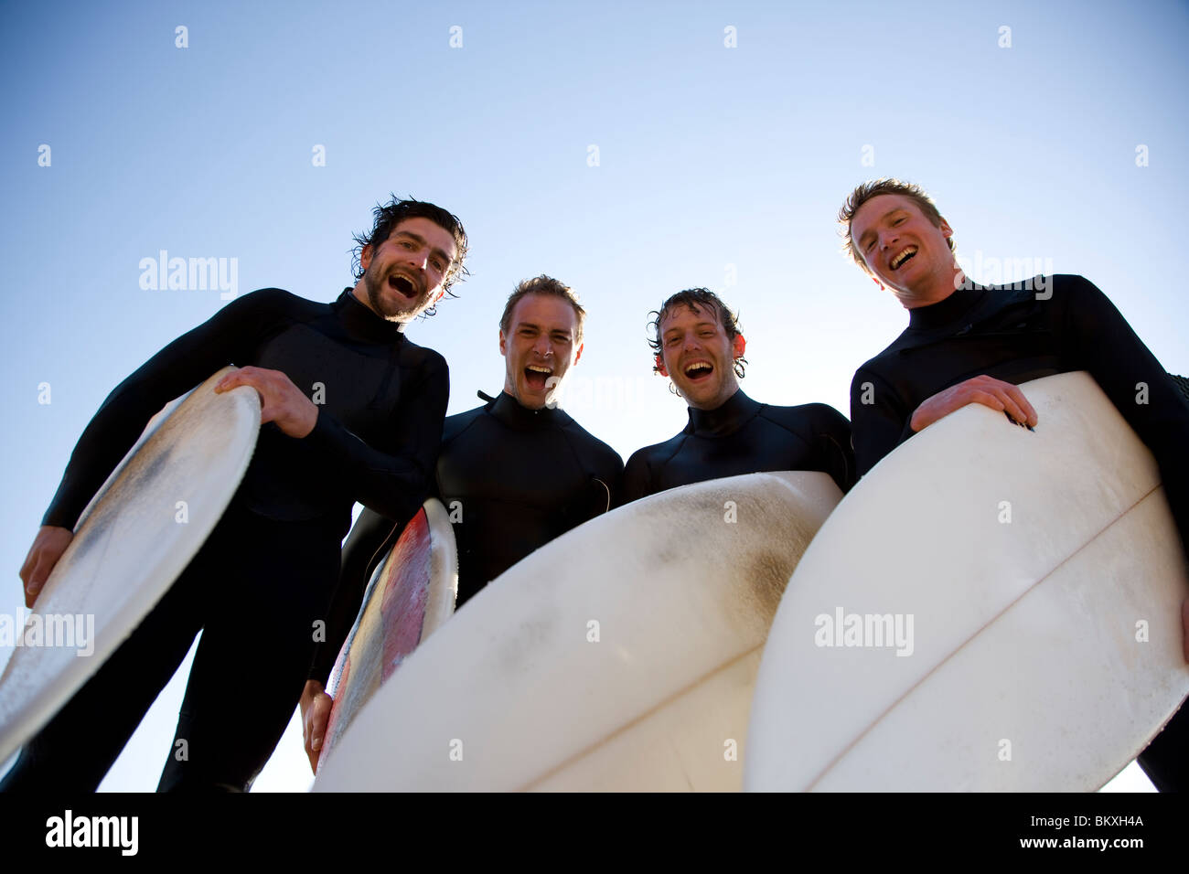 Surfers Holding Surfboards High Resolution Stock Photography and Images ...