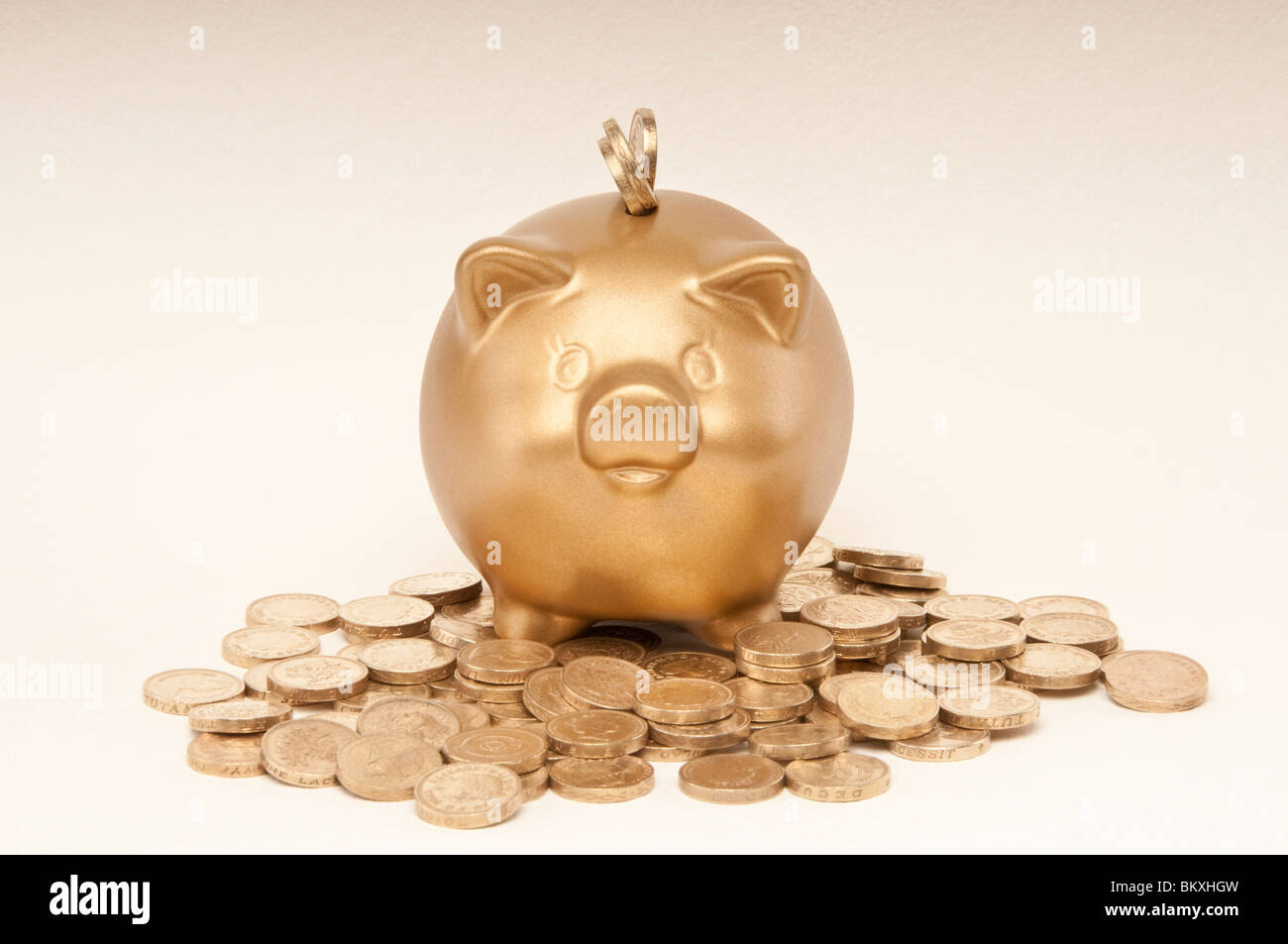 Child's piggy bank and pound coins Stock Photo - Alamy
