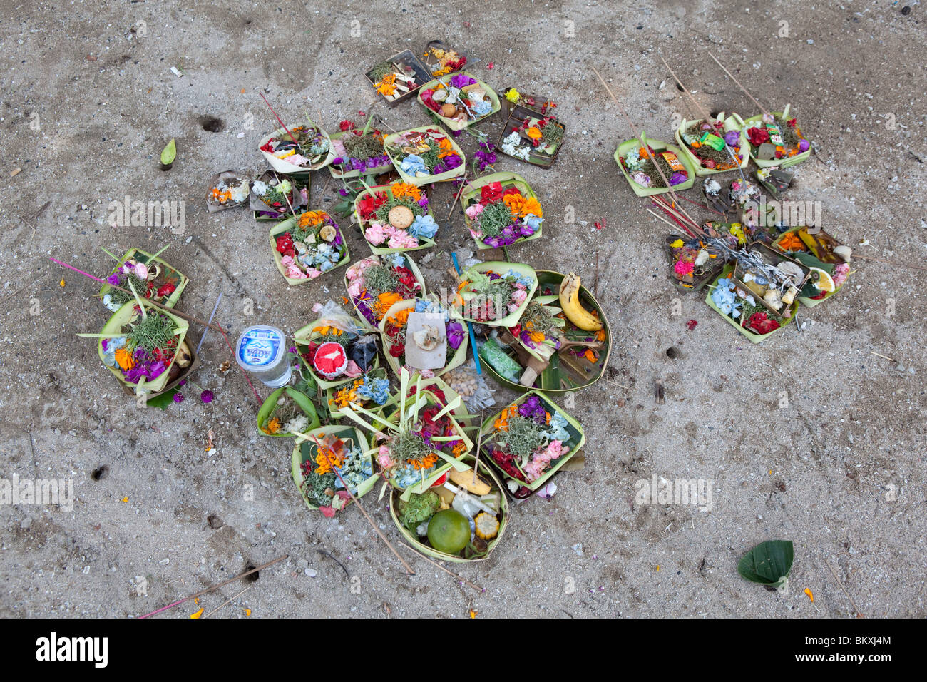 Offerboxes with flowers and food in Bali Stock Photo - Alamy