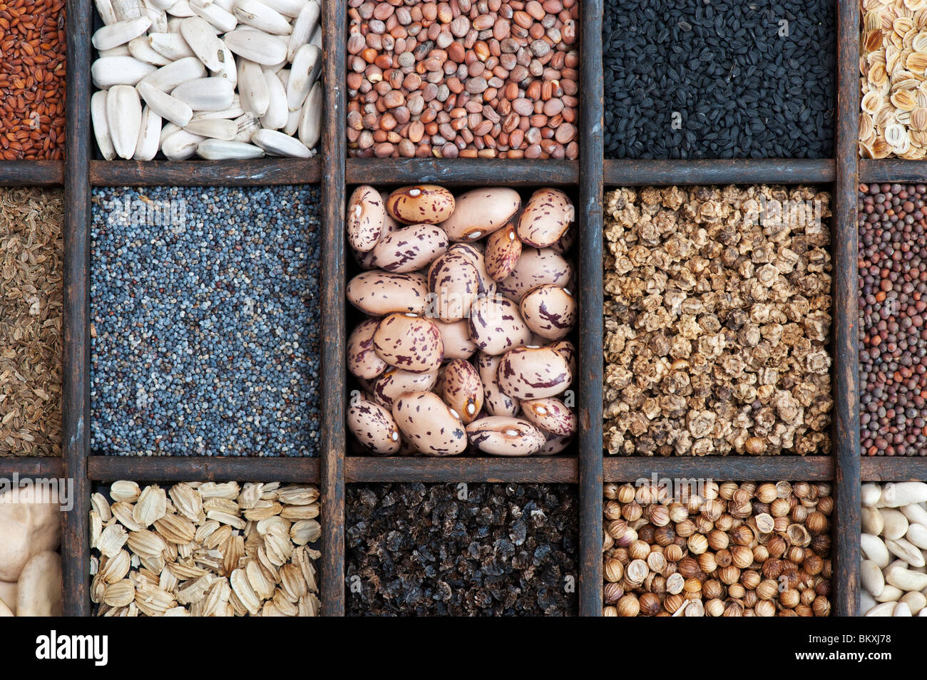 Selection of Vegetable and flower seeds in a wooden tray. Flat lay ...