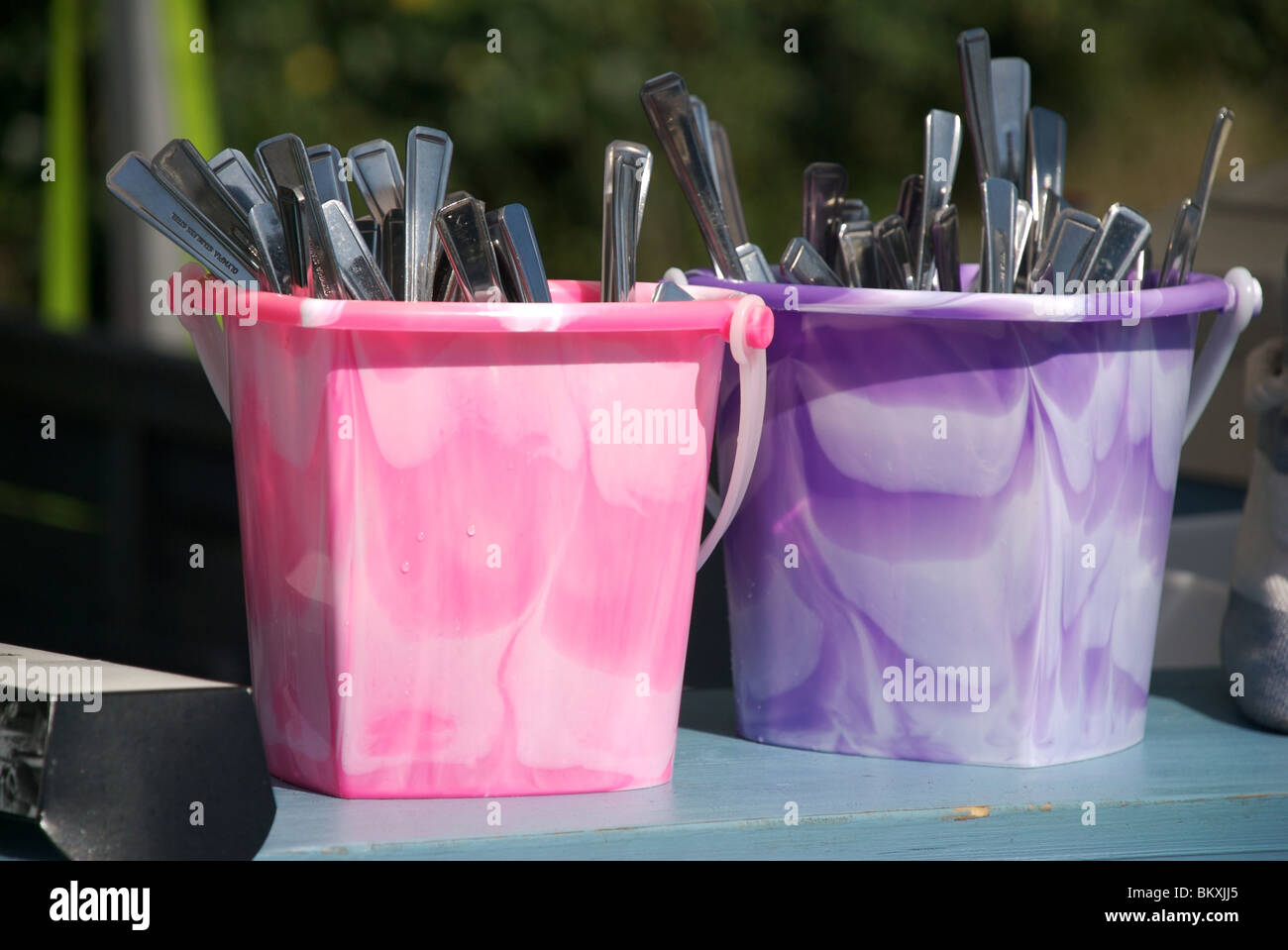 Colourful cutlery buckets, Salcombe, Devon, UK Stock Photo - Alamy