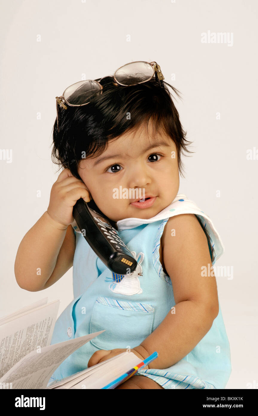 Indian kids talking mobile hi-res stock photography and images - Alamy