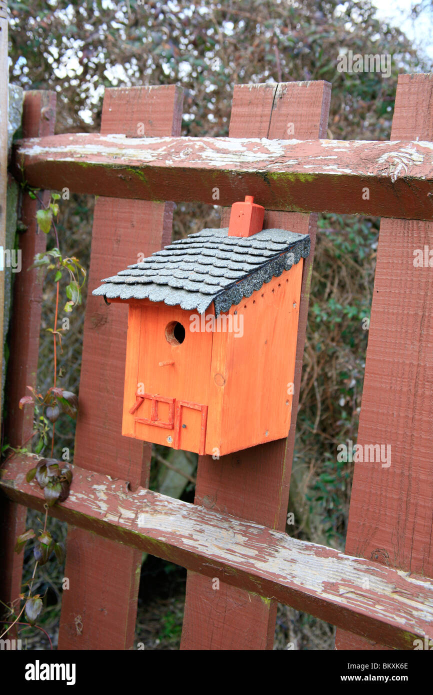bird house on fence in garden Stock Photo - Alamy