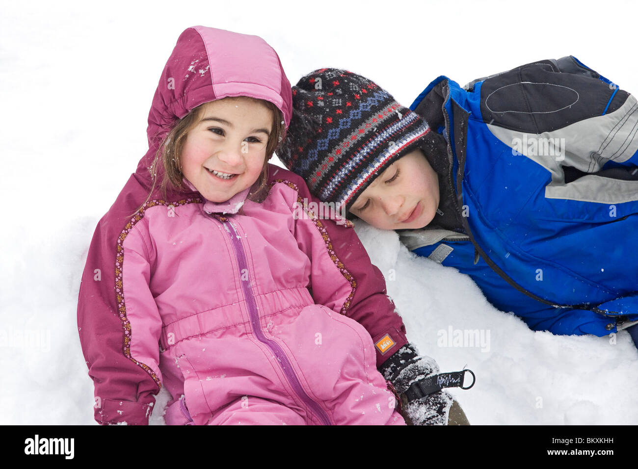 Children play in snow during winter, USA Stock Photo - Alamy