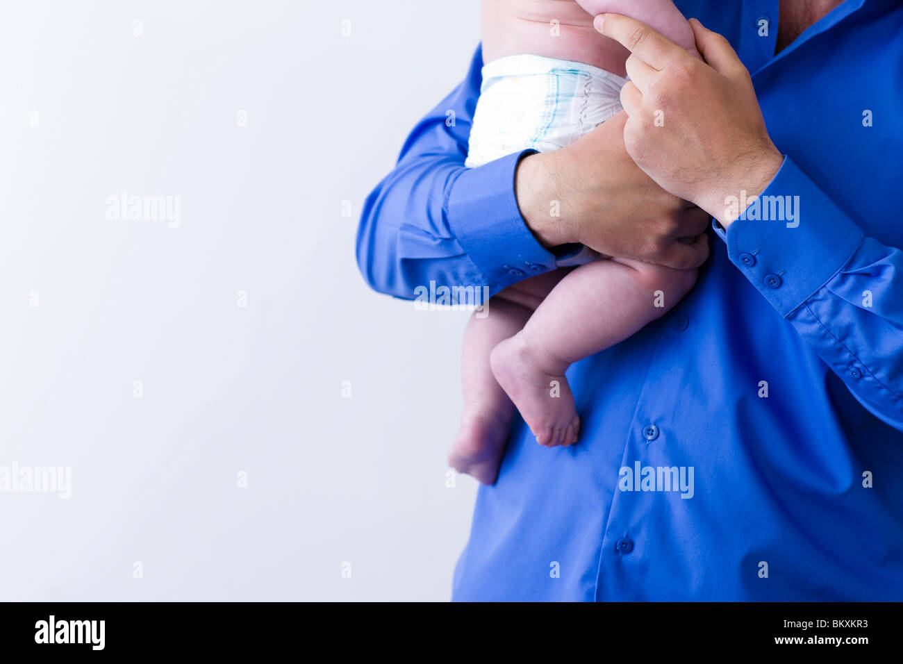 Holding up baby in diaper hi-res stock photography and images - Alamy