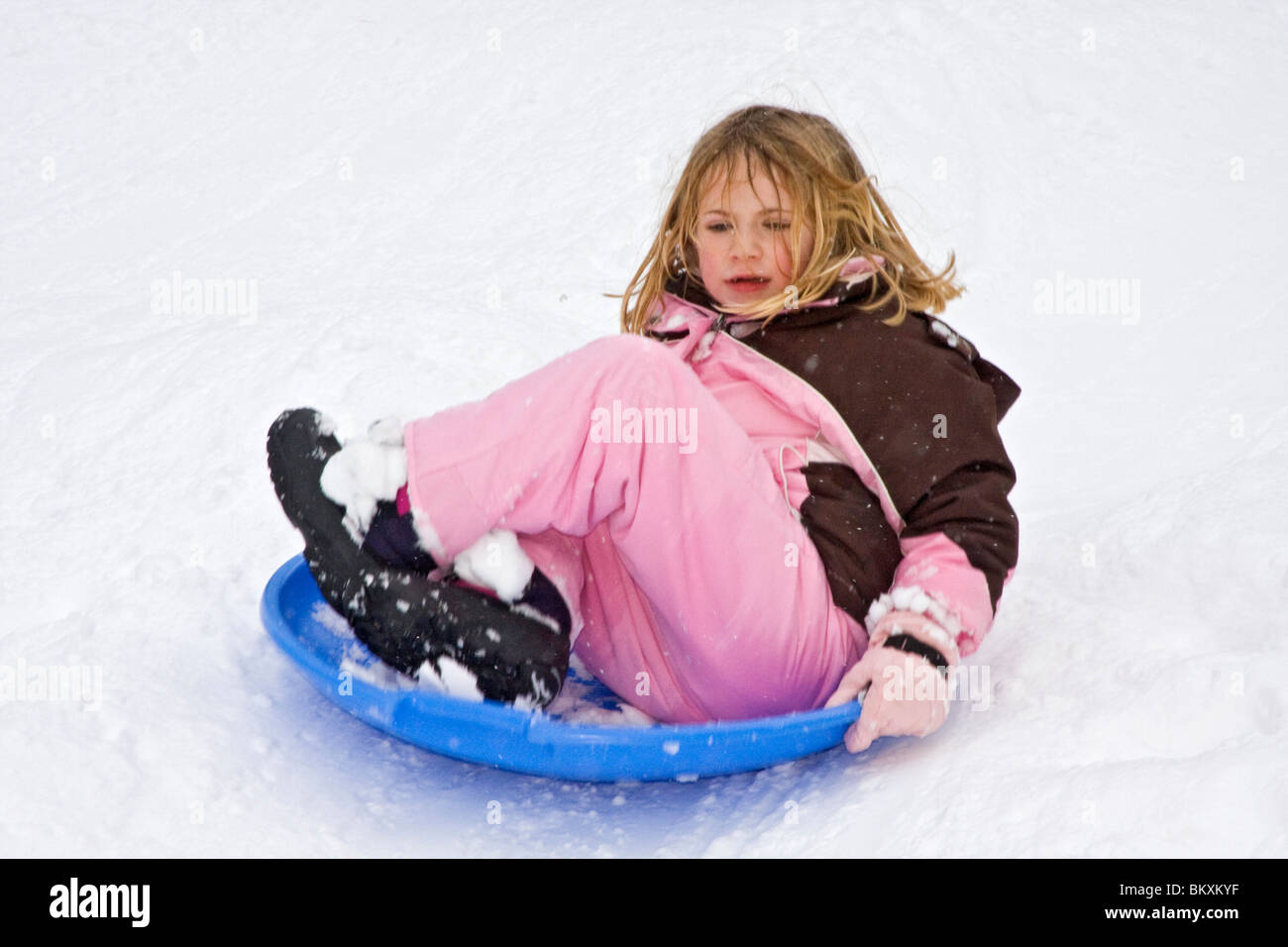 Children sled down short slope in winter, South Lake Tahoe, California ...