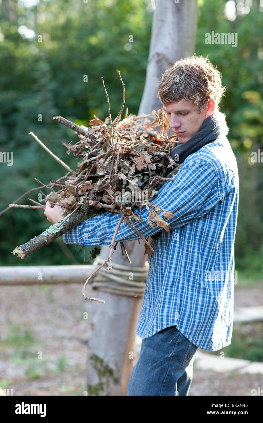 Young Man Carrying Firewood High Resolution Stock Photography and ...