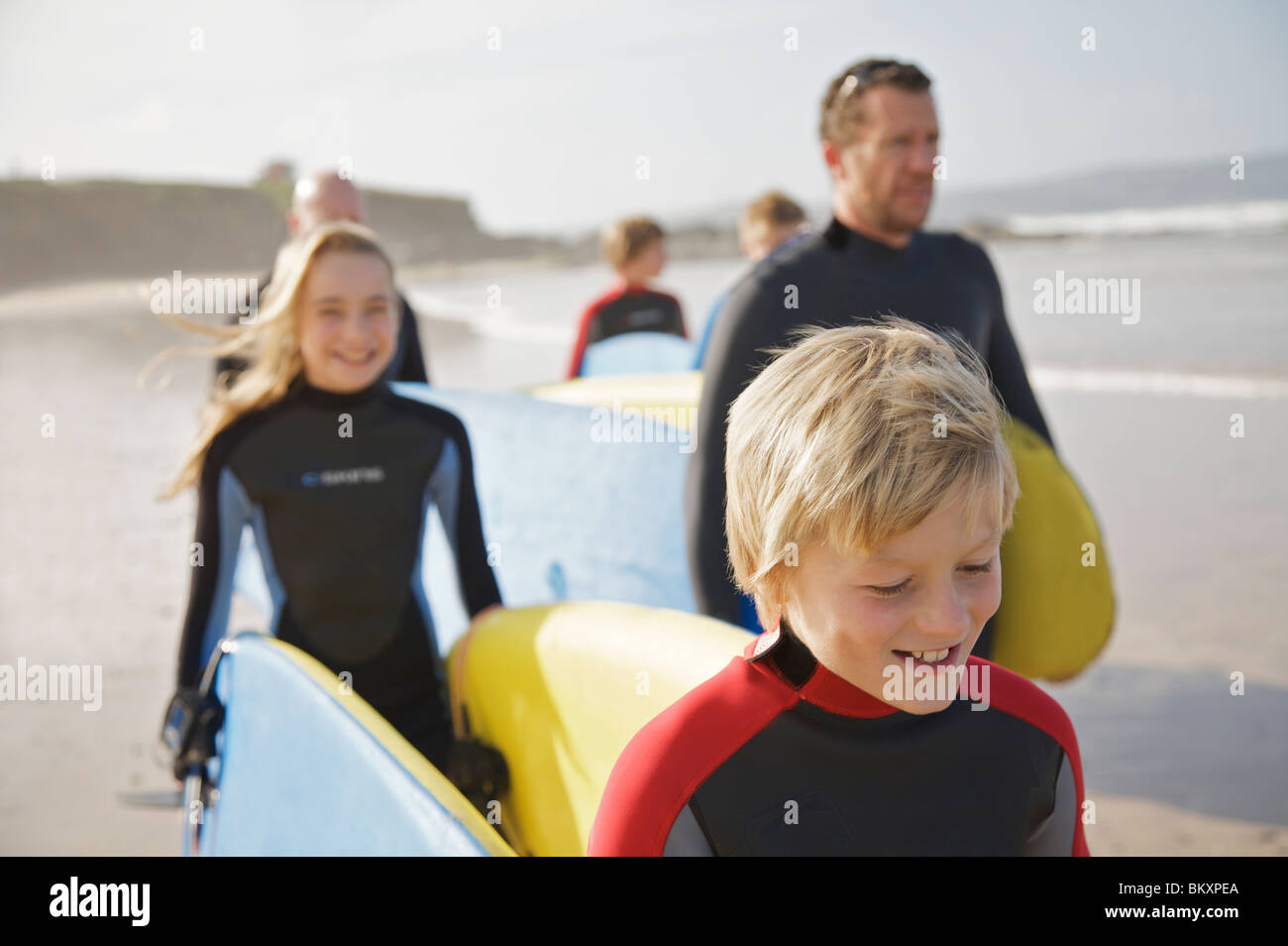 Boy carrying a surfboard hi-res stock photography and images - Alamy