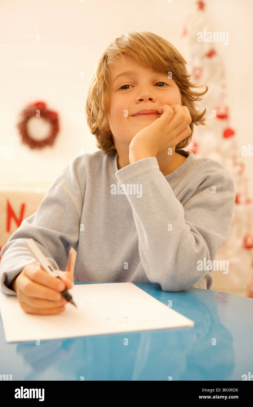 Boy Writing At Table Happy High Resolution Stock Photography and Images ...