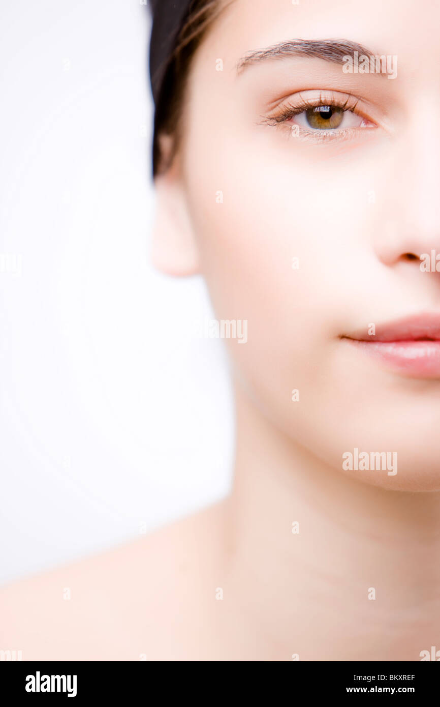 Close up of a young woman - half face Stock Photo - Alamy