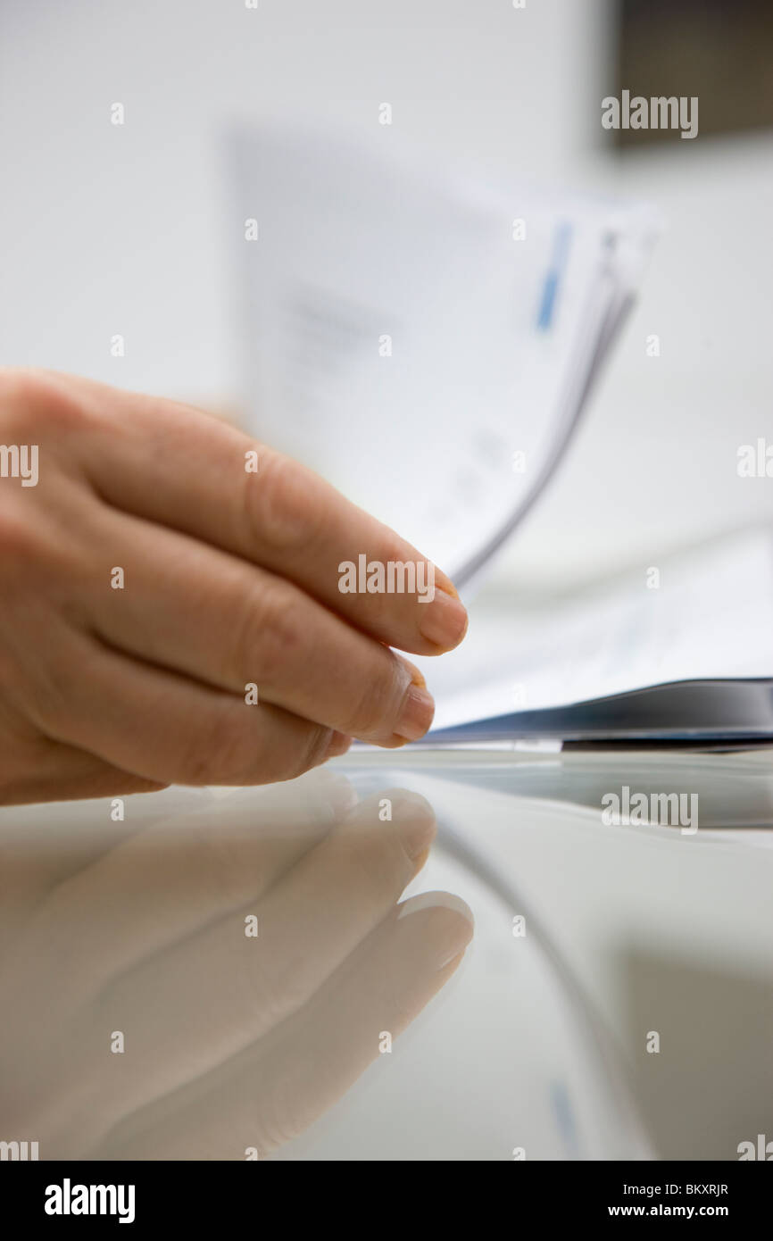 Woman sorting bills hi-res stock photography and images - Alamy