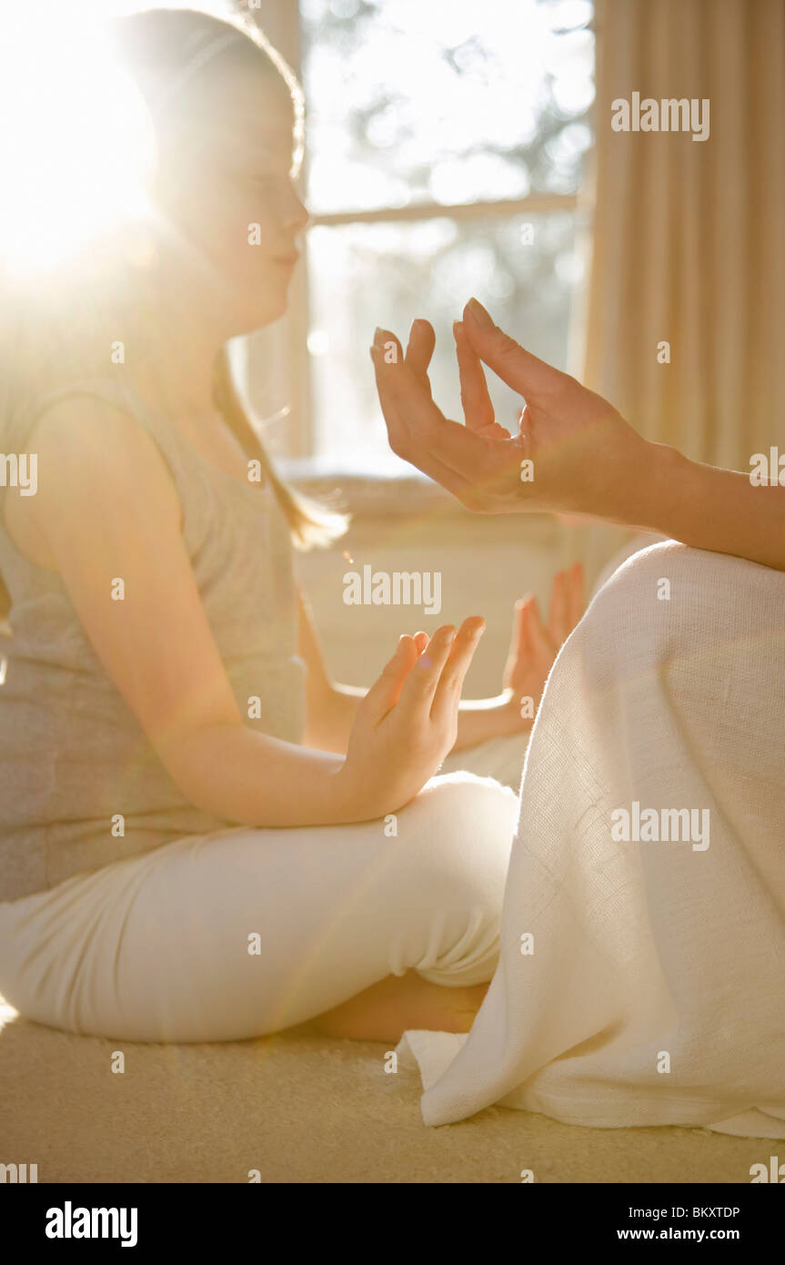 Young women sitting opposite each other hi-res stock photography and ...