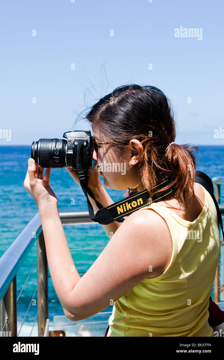 Female Photographer With Camera Nikon