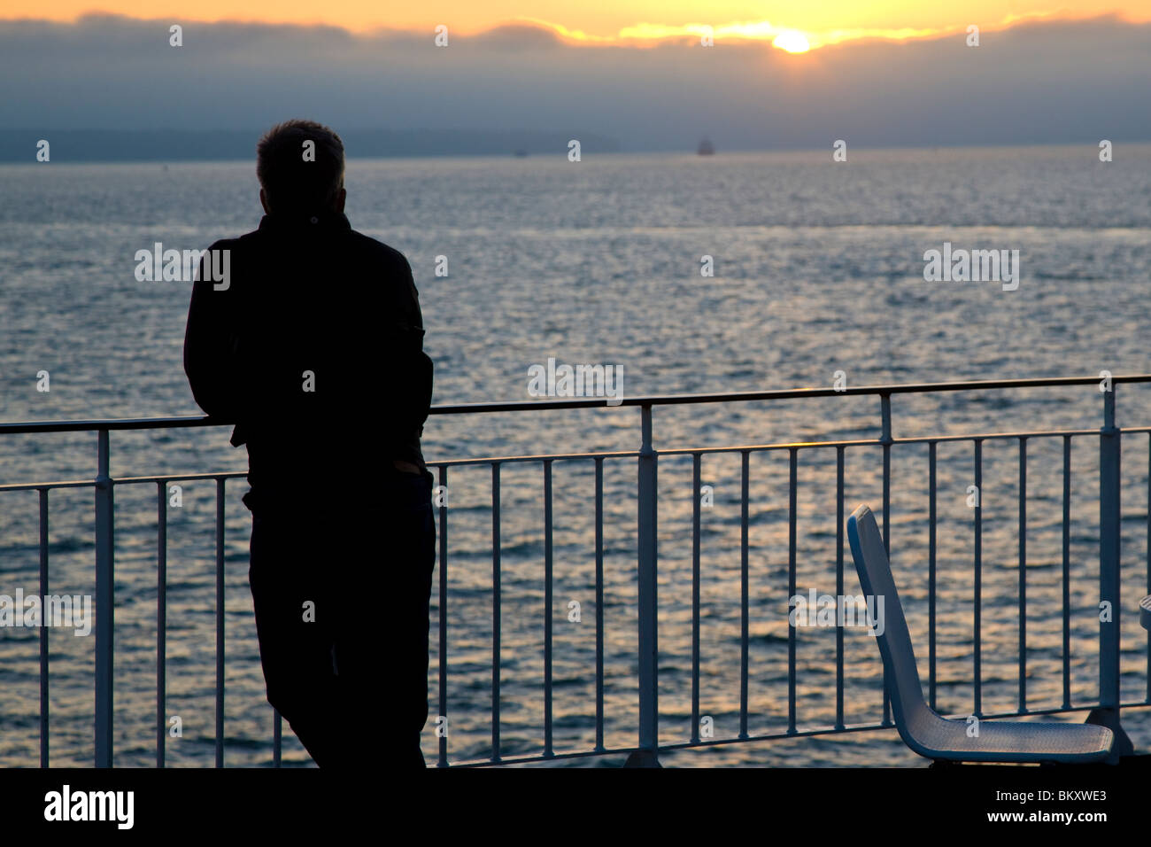 Man looking over railings hi-res stock photography and images - Alamy