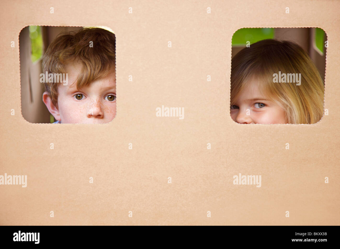Child peeking out of playhouse hi-res stock photography and images - Alamy