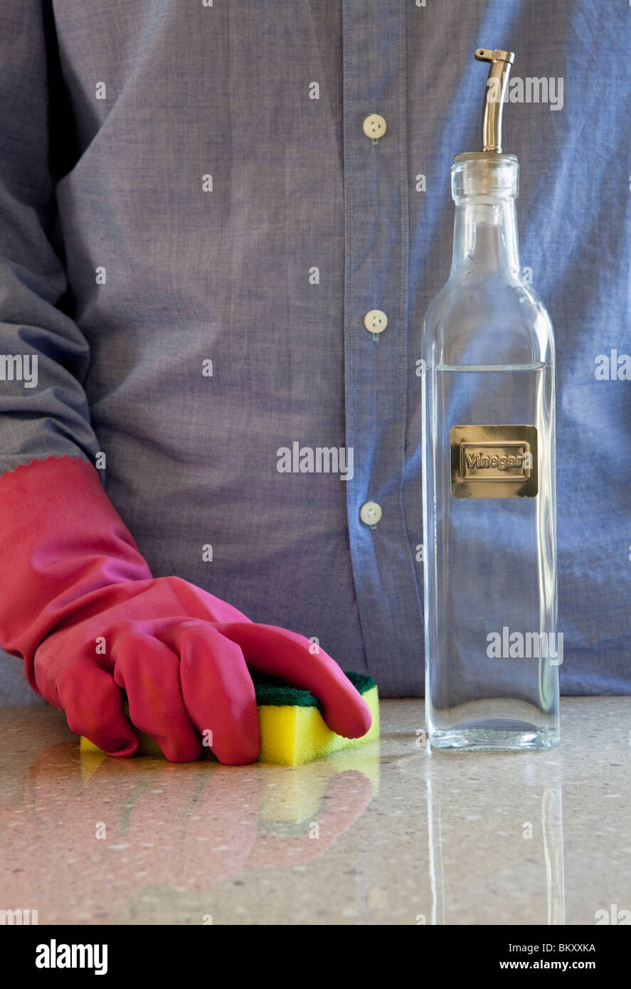 Cleaning with white vinegar in a bottle labelled 'Vinegar'. Vinegar can ...