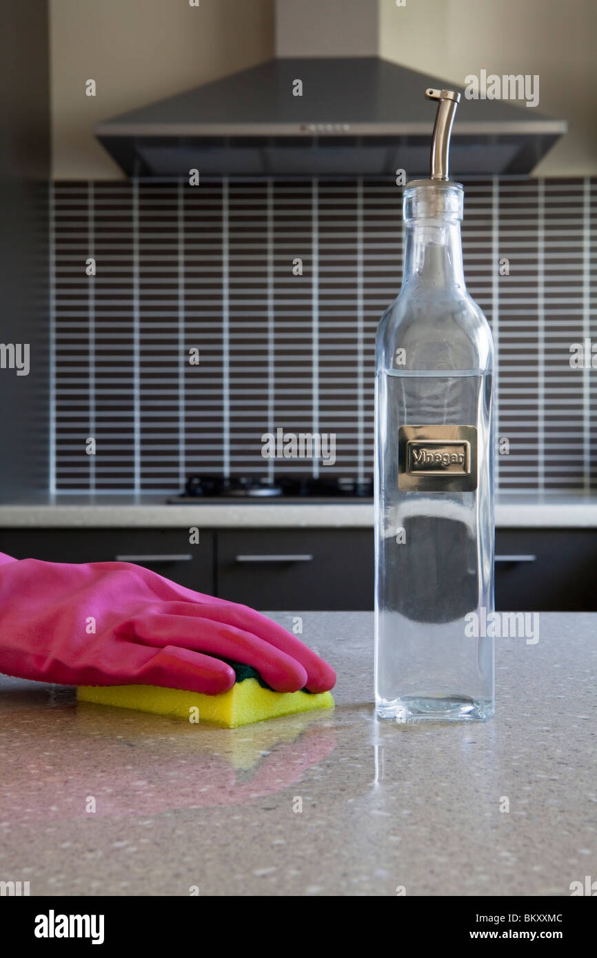 Cleaning with white vinegar in a bottle labelled 'Vinegar'. Vinegar can ...
