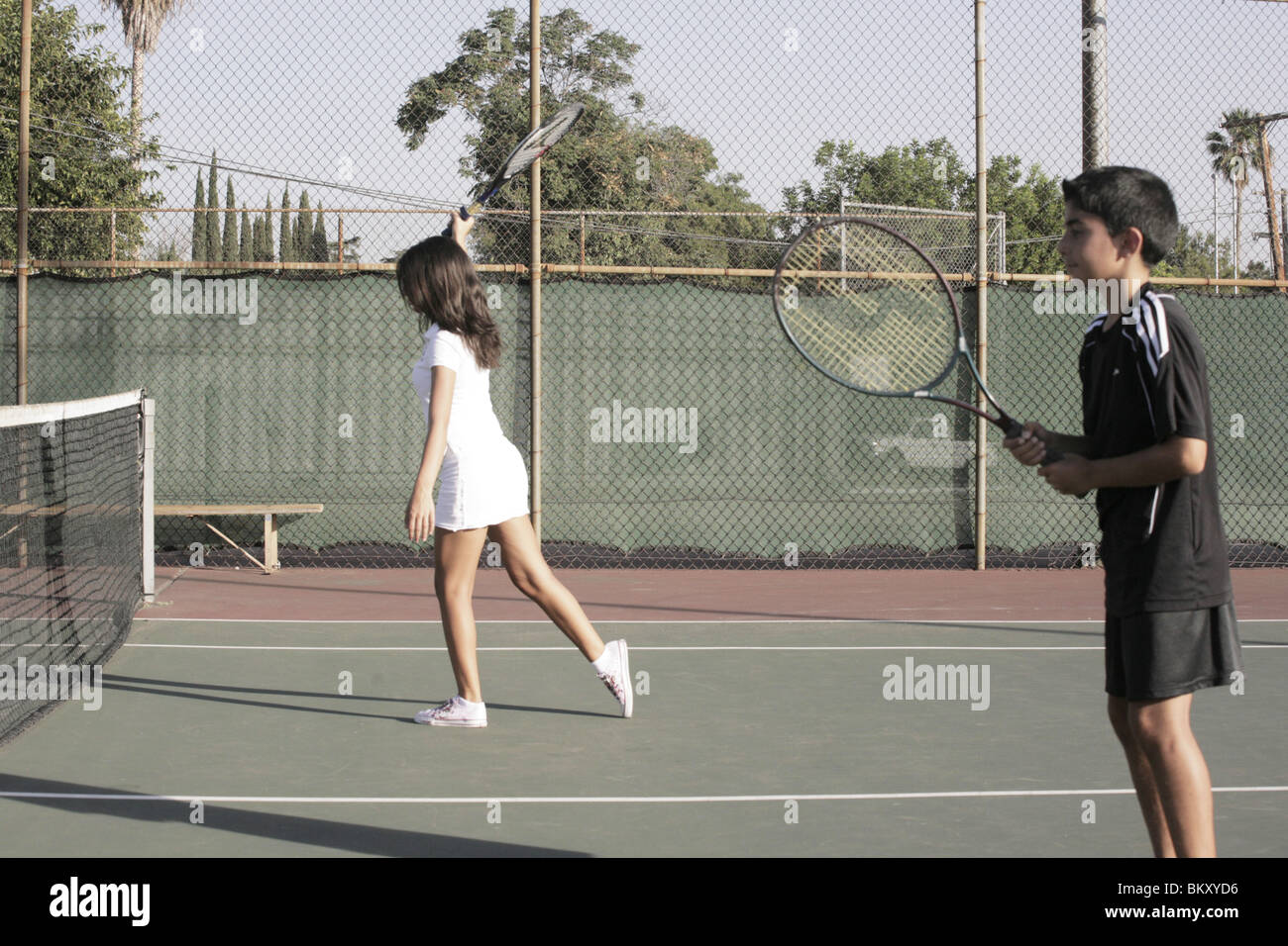 Two children playing tennis Stock Photo - Alamy
