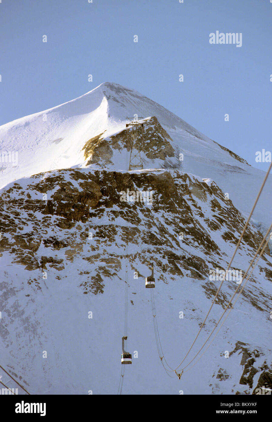 Two ski lifts going up mountain Stock Photo - Alamy