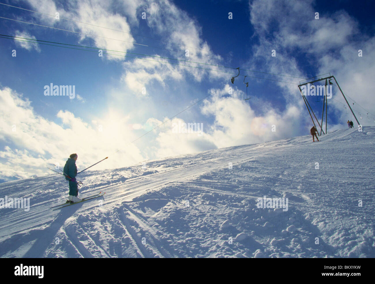 People being taken up slope by ski tug Stock Photo - Alamy