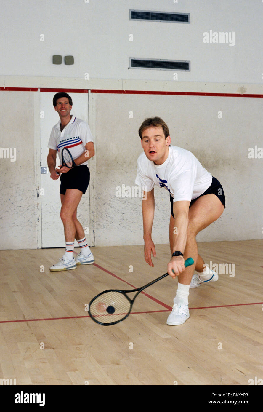 Two men playing racqetball Stock Photo - Alamy