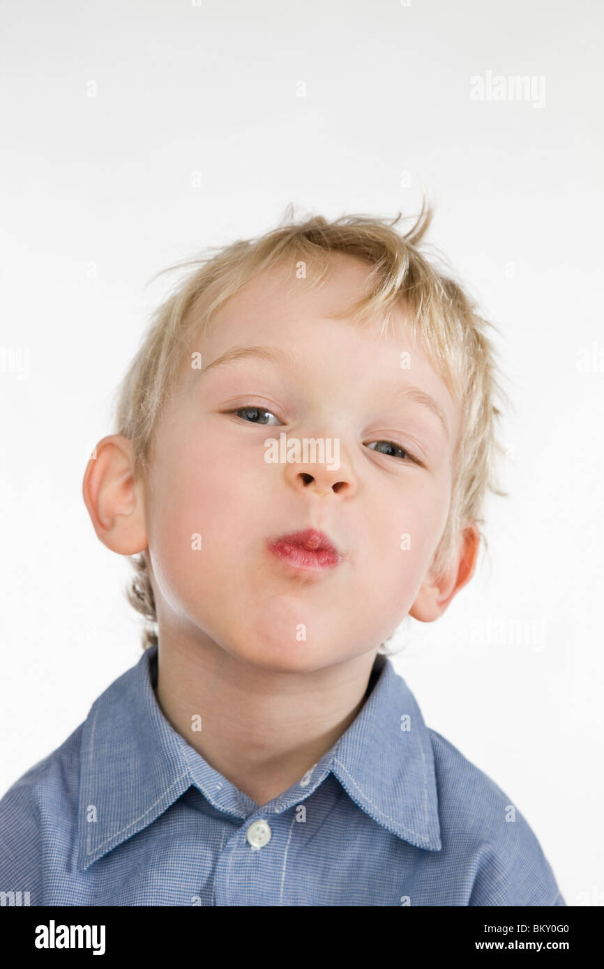 small boy making faces Stock Photo - Alamy