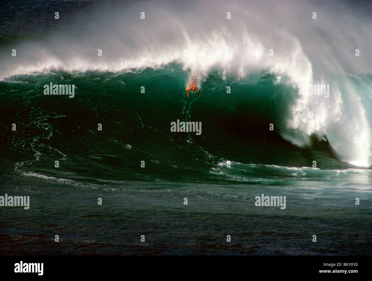 Man riding large wave in ocean Stock Photo - Alamy