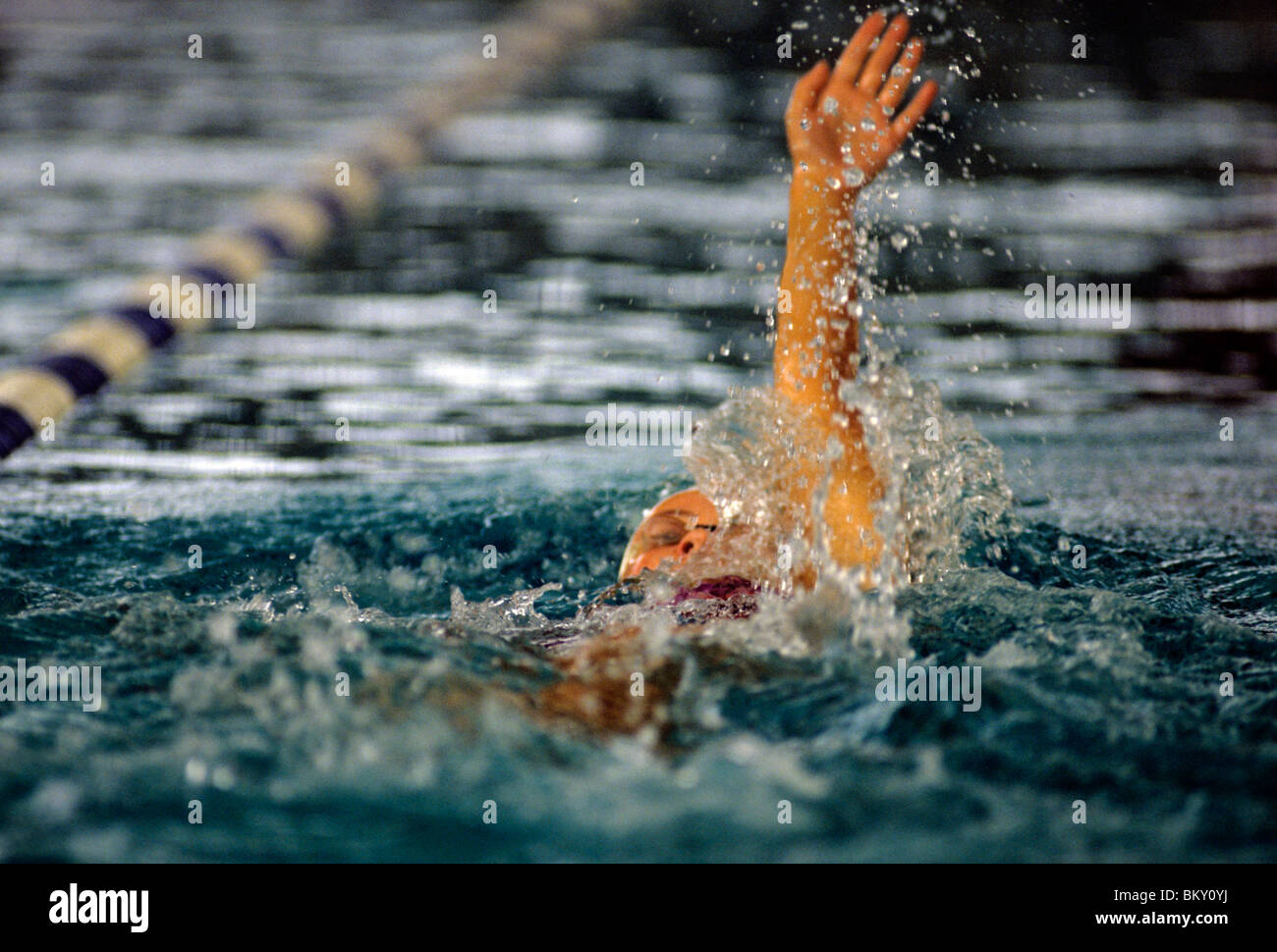 Woman doing backstroke while swimming Stock Photo - Alamy