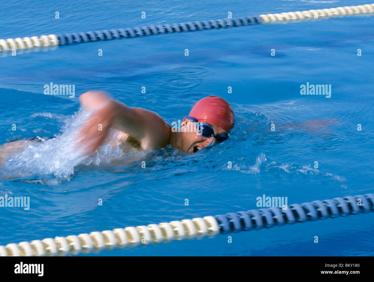 Man swimming front crawl in pool Stock Photo - Alamy
