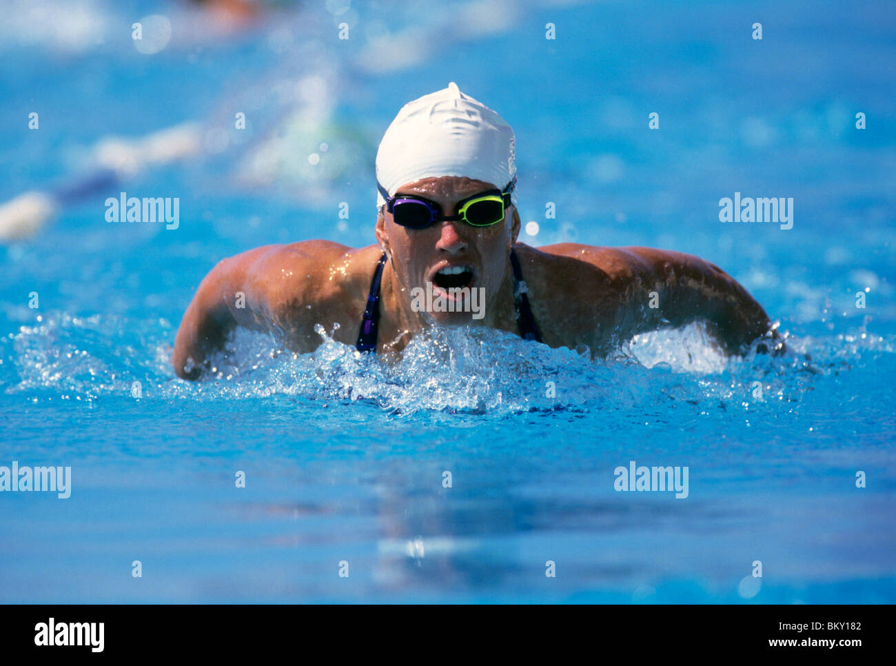 Person swimming butterfly in pool Stock Photo - Alamy
