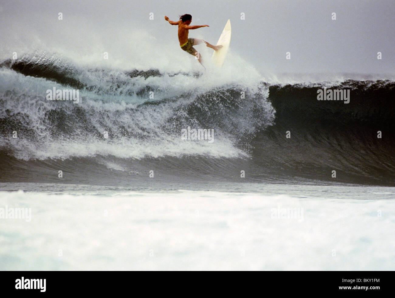 Man getting air while surfing wave Stock Photo - Alamy
