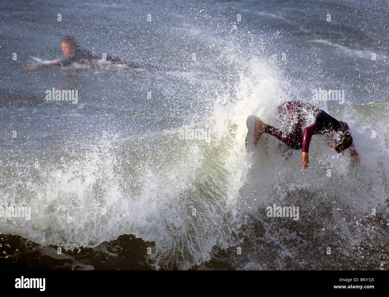 Person surfing in choppy water Stock Photo - Alamy